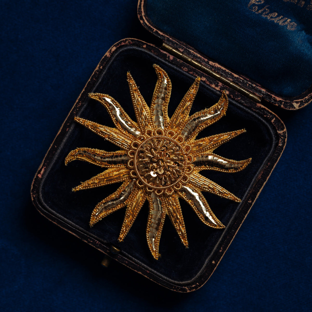 The Blazing Sun Brooch – Hand & Lock
